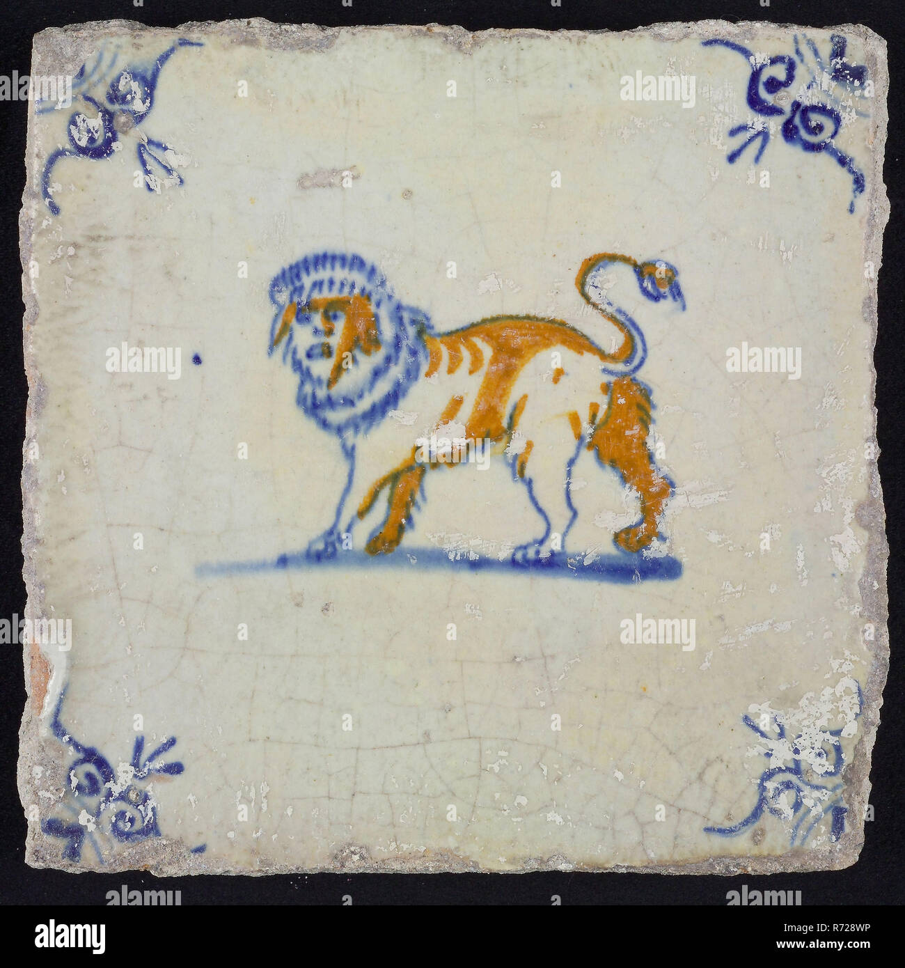 Animal tile, lion facing left looking at us in blue and brown on white ...