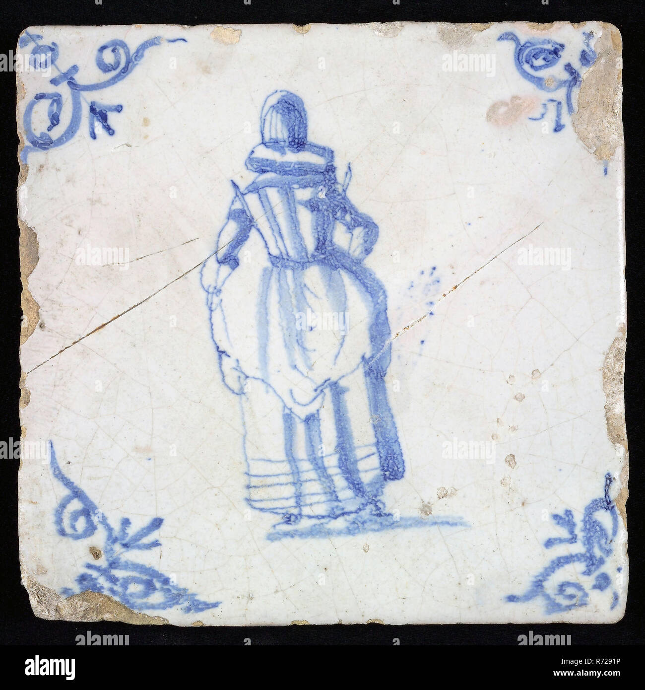 Figure tile, blue with lady with millstone collar and recorded overcoat ...