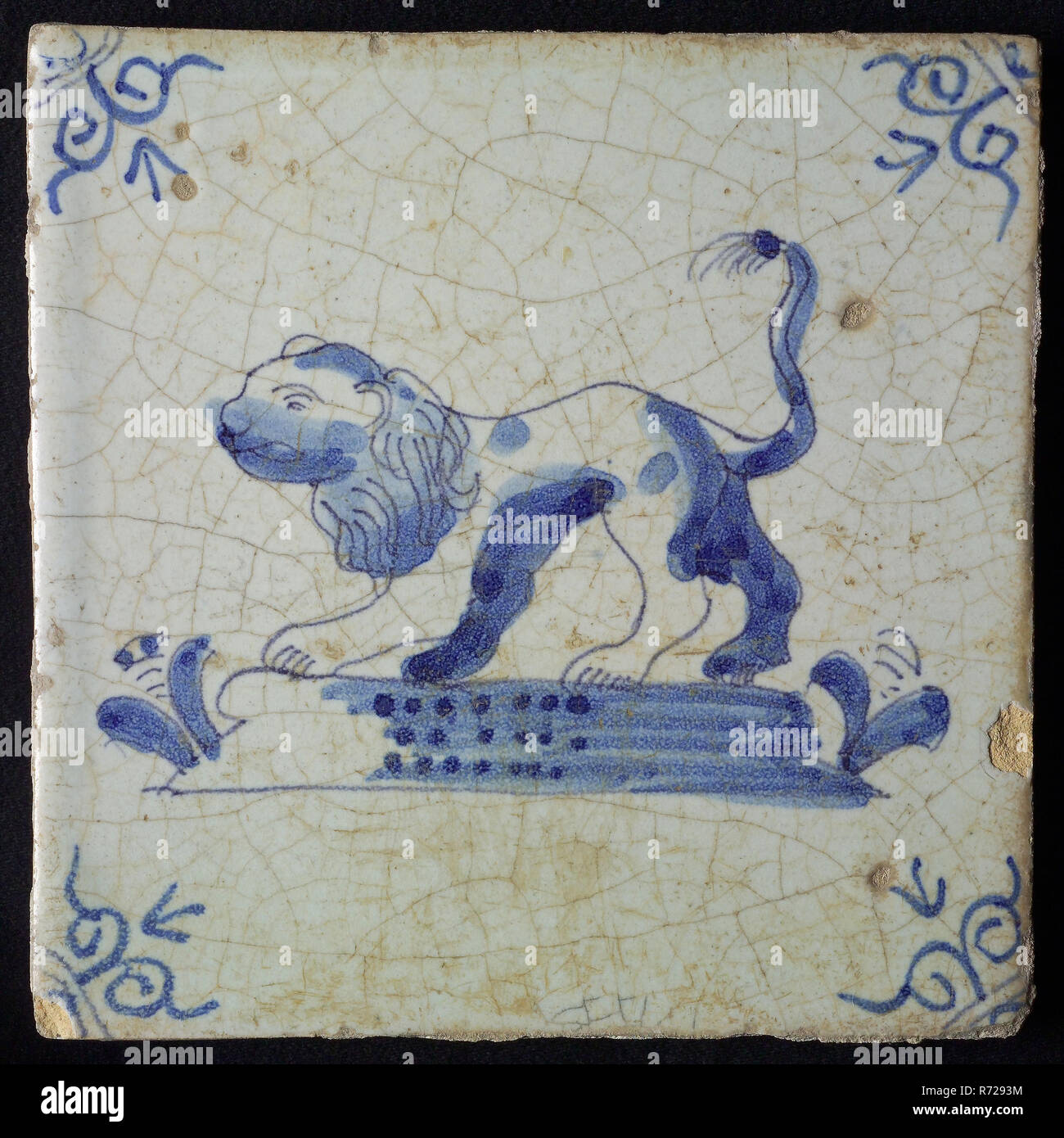 Animal tile, running lion to the left on plot, in blue on white, corner ...