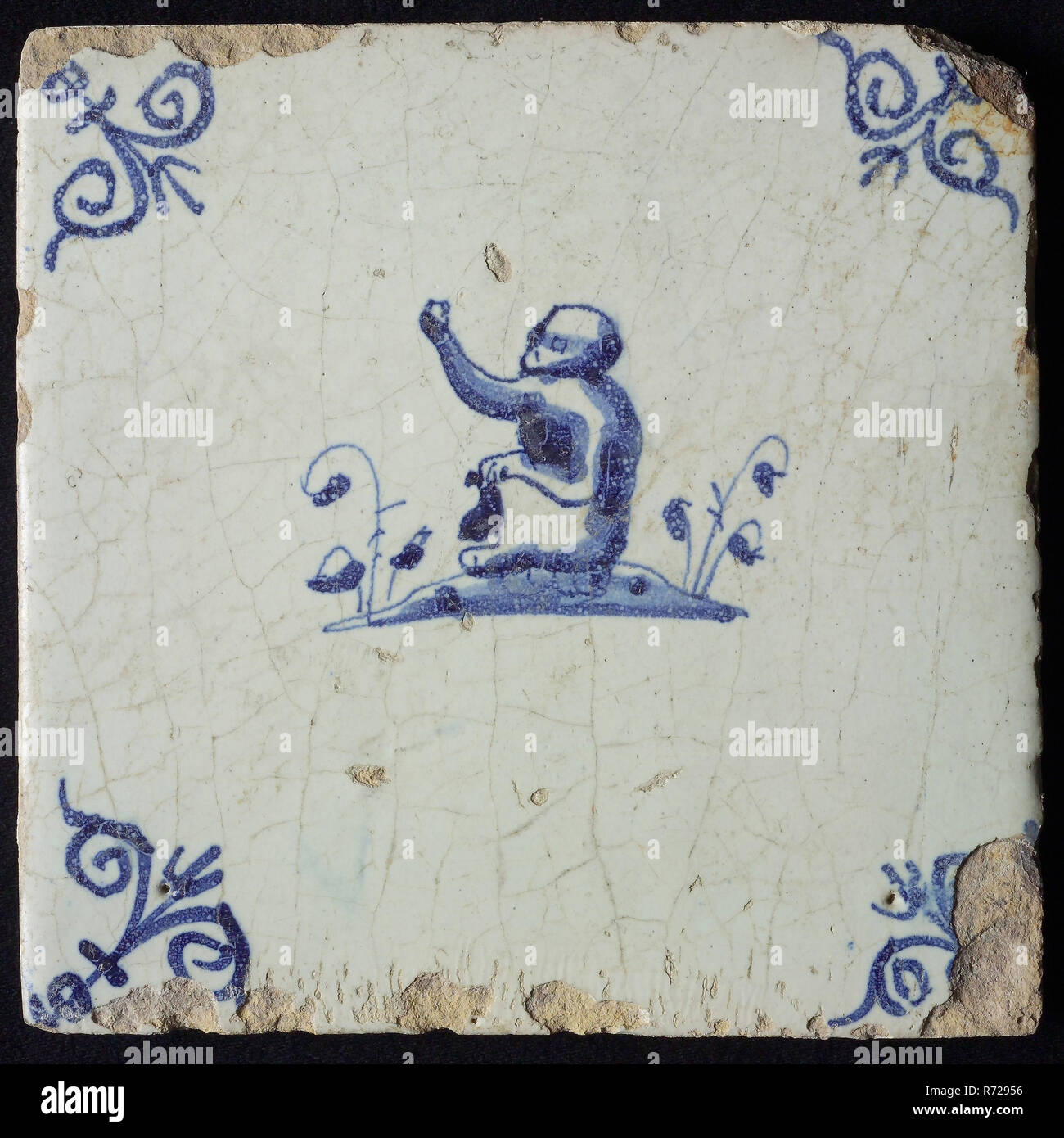 Animal tile, sitting monkey to the left on plot, in blue on white ...