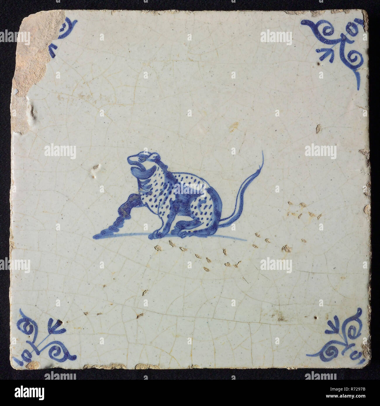 Animal tile, sitting panther to the left, in blue on white, corner ...