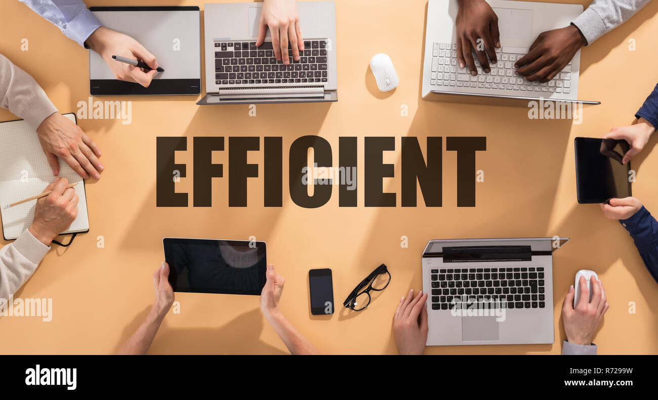 Efficient Word Surrounded With Businesspeople Using Electronic Gadgets efficient-word-surrounded-with-businesspeople-using-electronic-gadgets