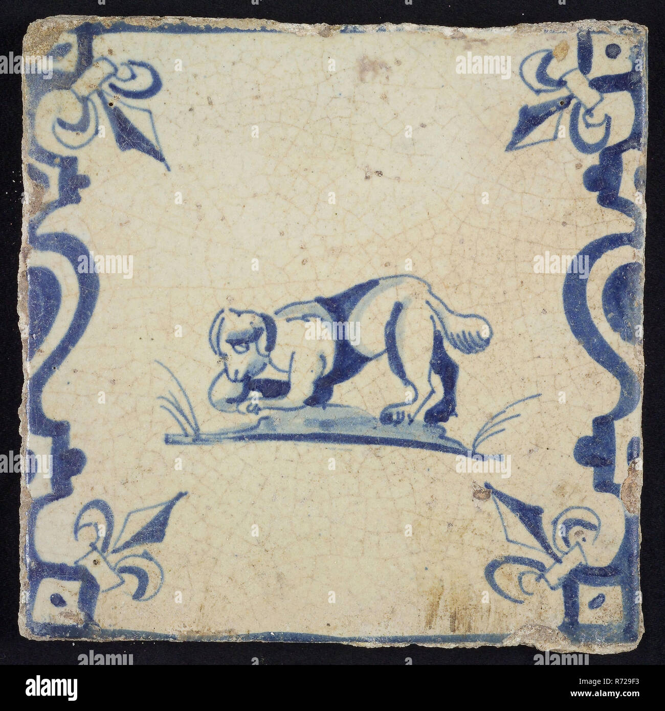 Animal tile, burrowing dog to the left on plot between balusters, in ...