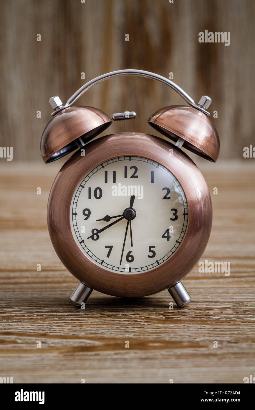 Old Fashioned Copper Alarm Clock Stock Photo - Alamy