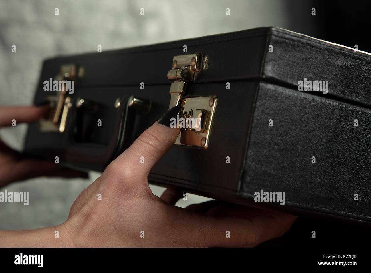 secretary tries to open the encrypted lock in the briefcase Stock Photo ...
