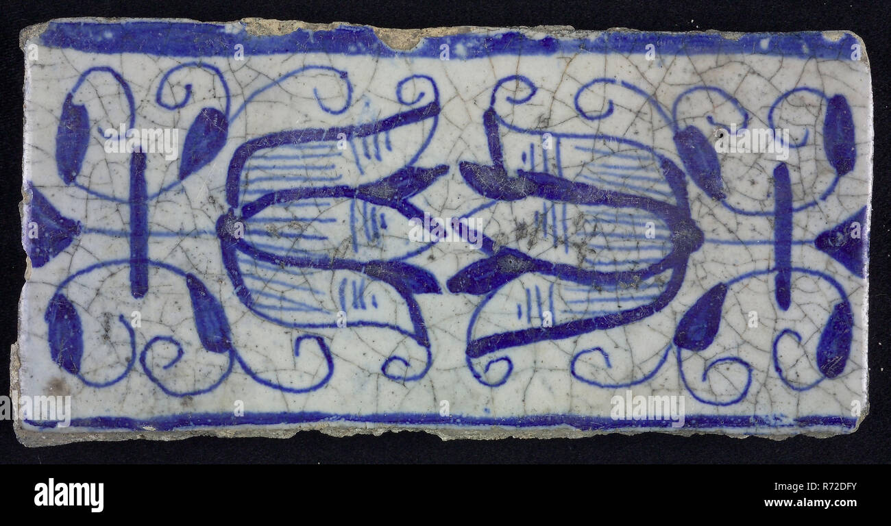 Blue border tile, waving floral pattern with tulips, above and below ...