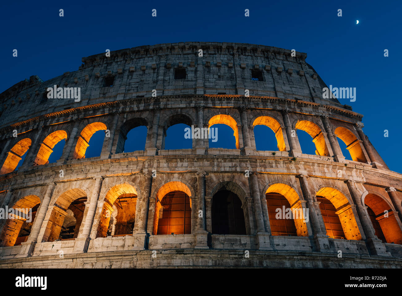 The Colosseum and moon at night in Rome, Italy Stock Photo - Alamy