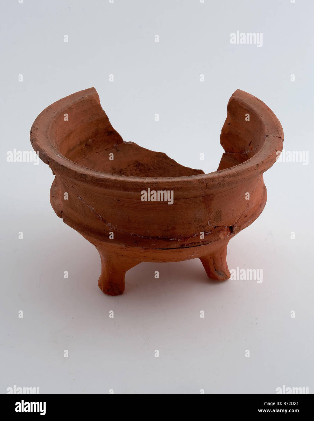 Fragment of pottery fire test, red shard, completely unglazed, on three ...