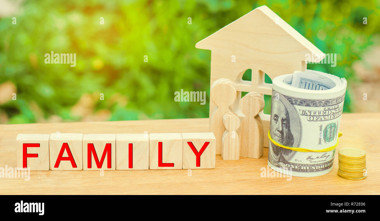 the family with money is standing near their house. concept of wealth ...