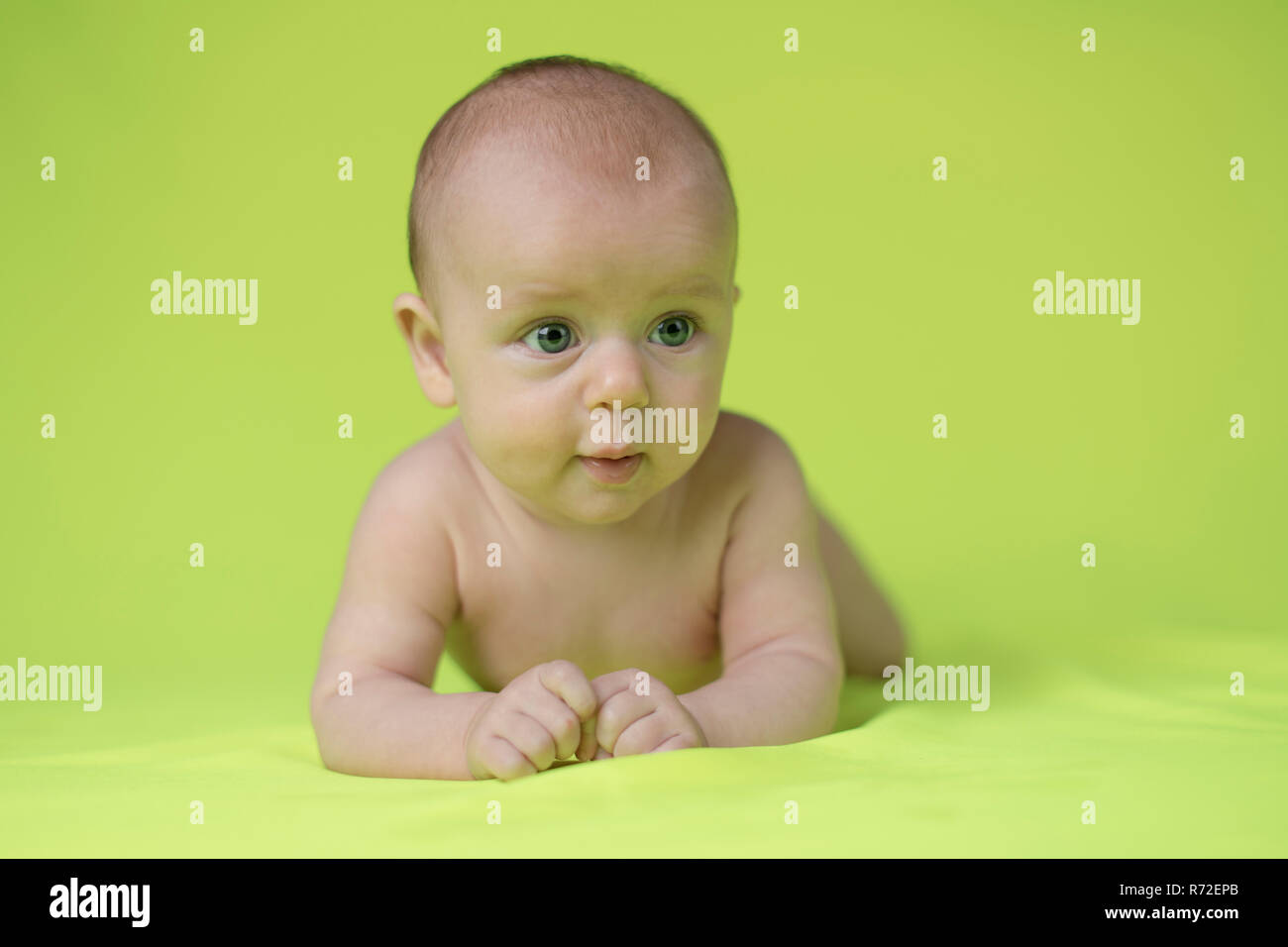 Cute happy baby girl crawling Stock Photo - Alamy