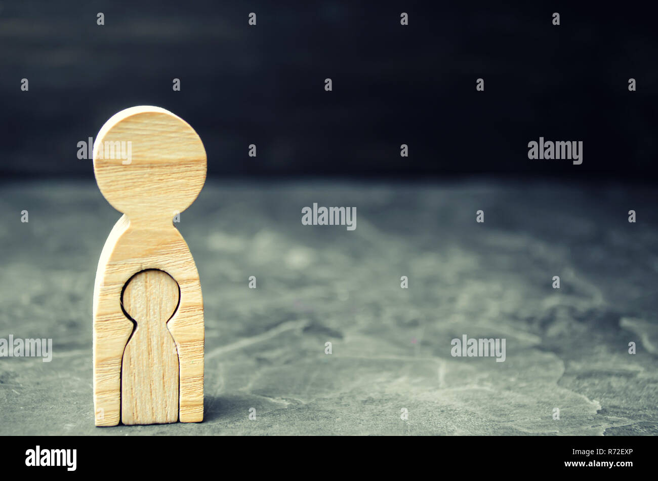 The wooden figure of a woman with a child inside. The concept of ...