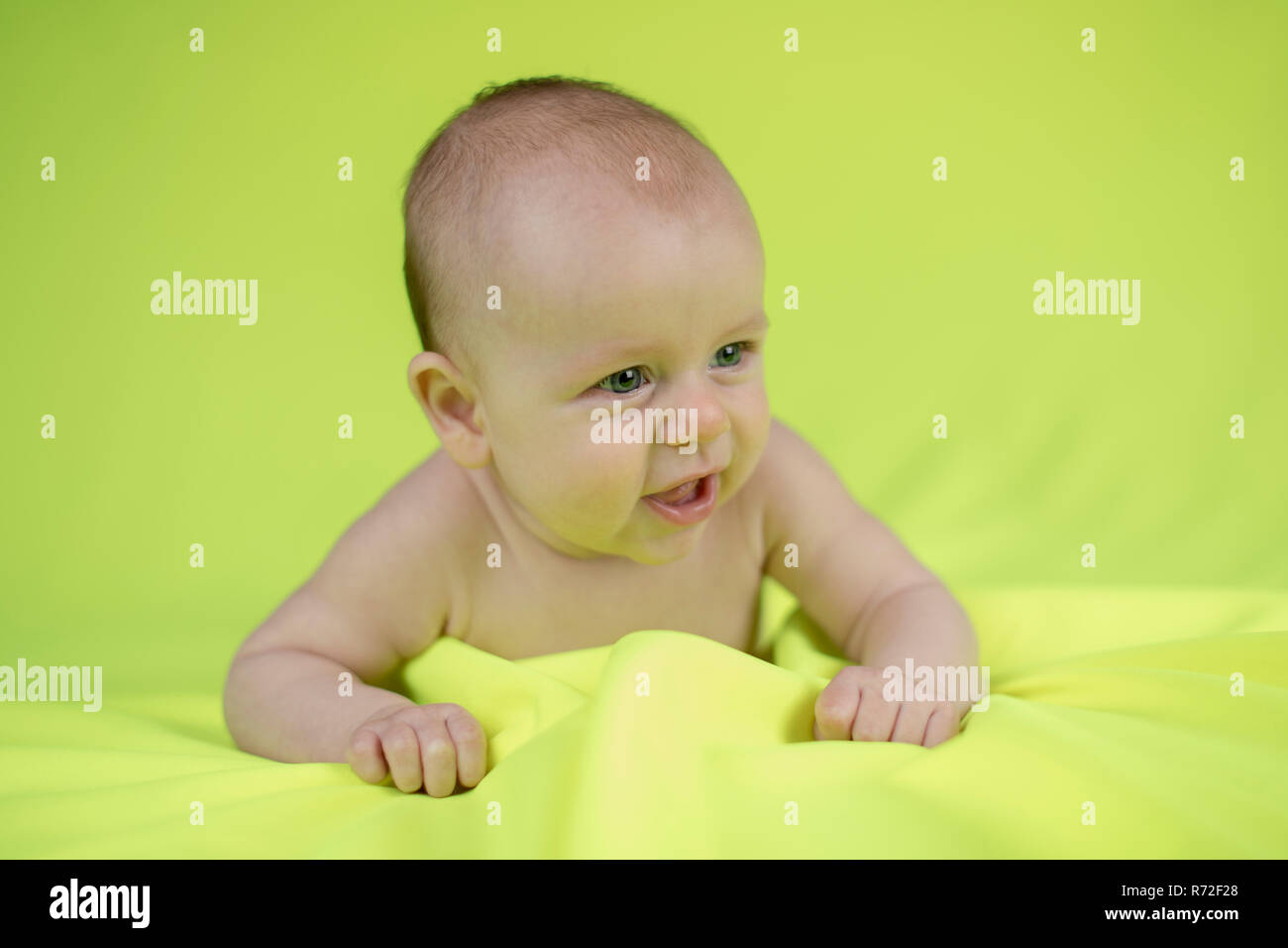 Cute happy baby girl crawling Stock Photo - Alamy