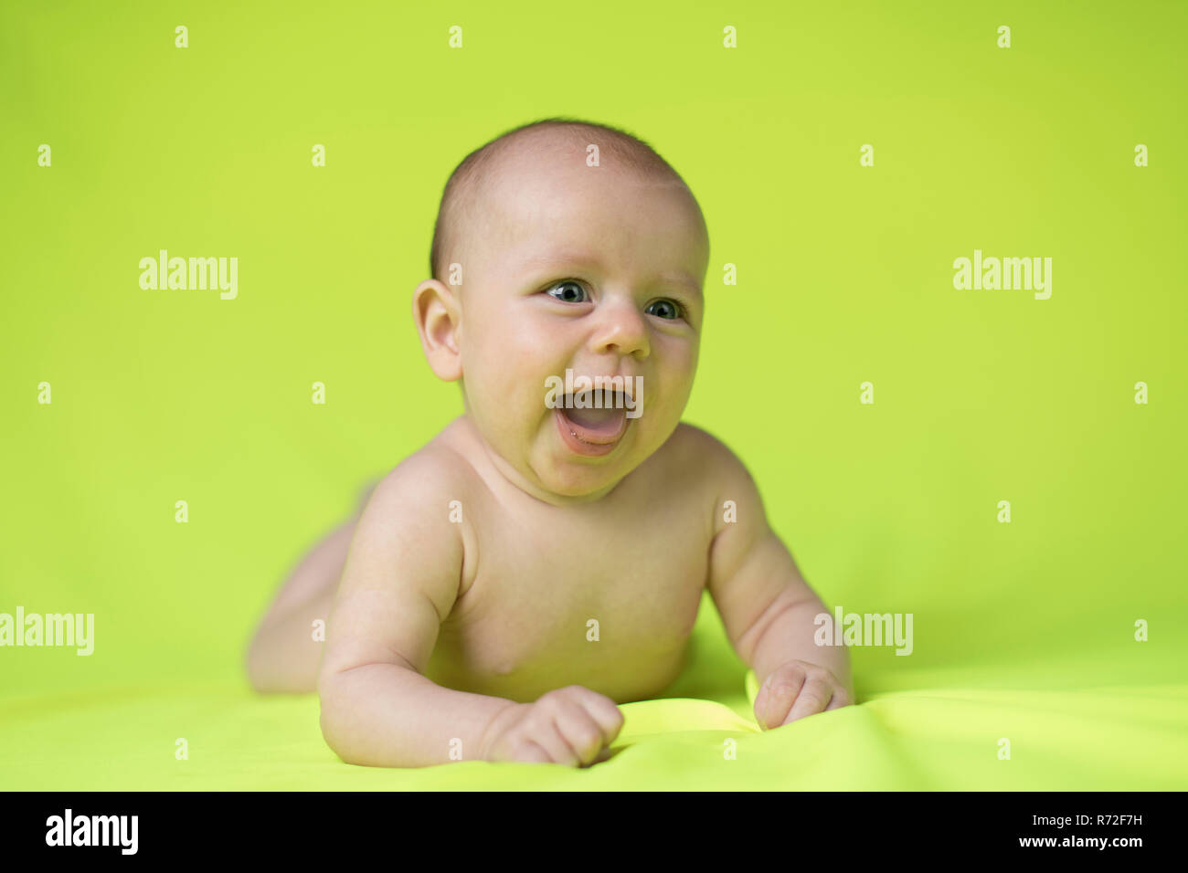 Cute happy baby girl crawling Stock Photo - Alamy