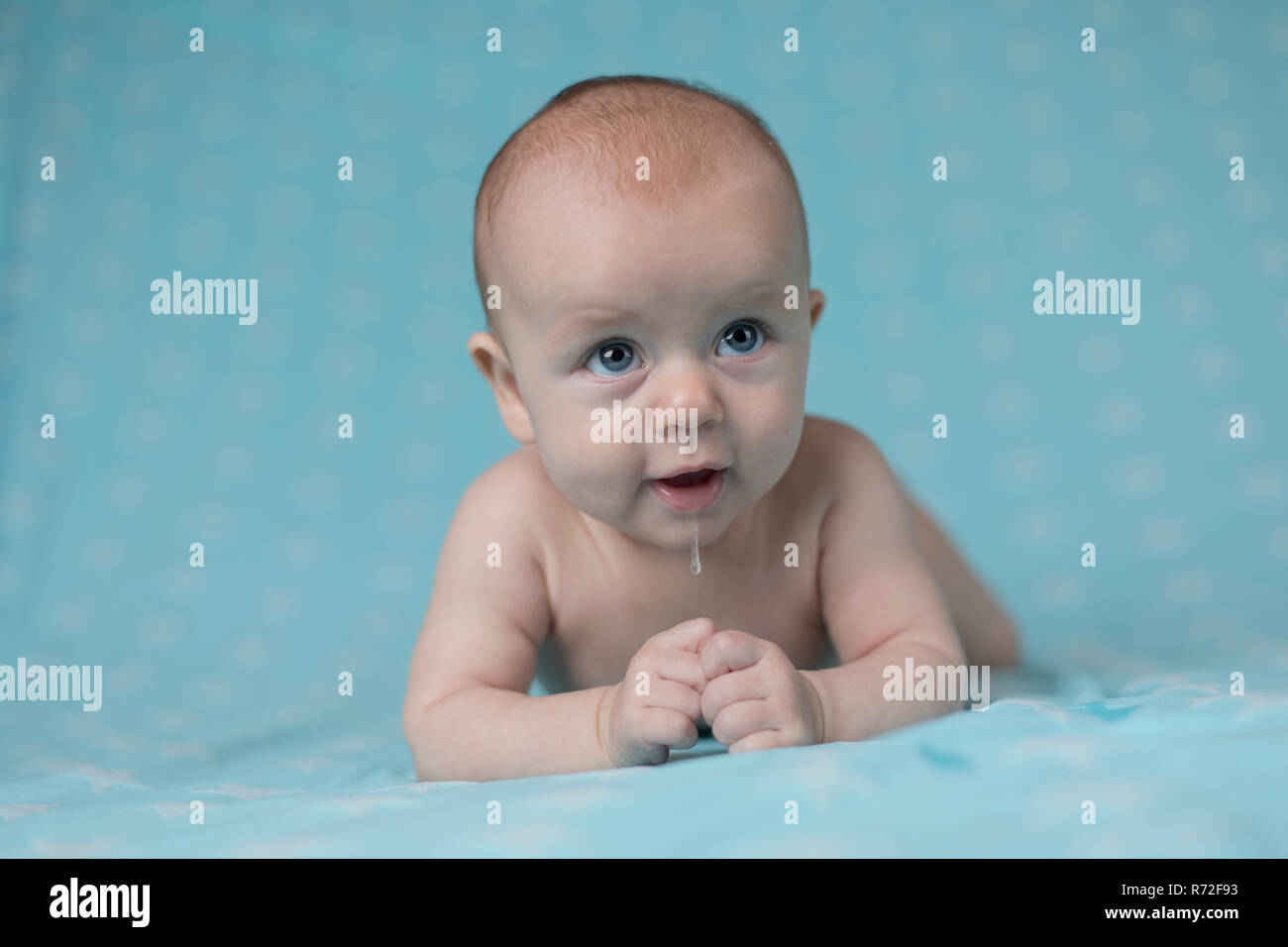 Cute happy baby girl crawling Stock Photo - Alamy