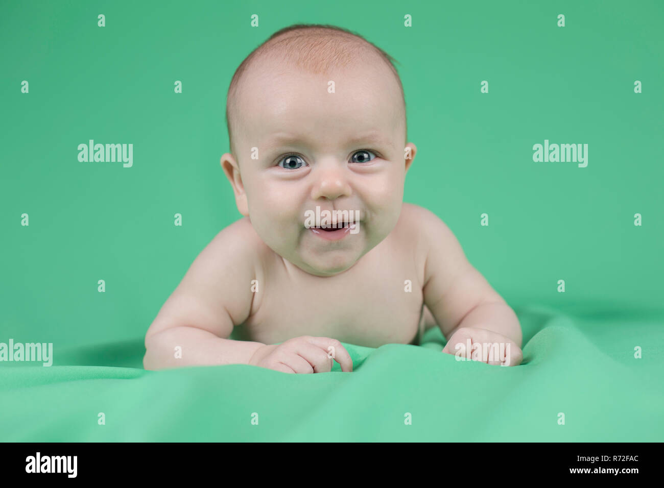 Cute happy baby girl crawling Stock Photo - Alamy