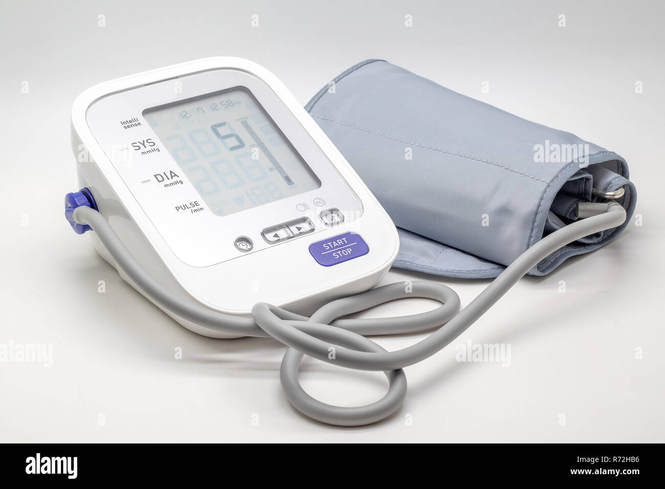 High blood pressure digital monitor on white background Stock Photo - Alamy