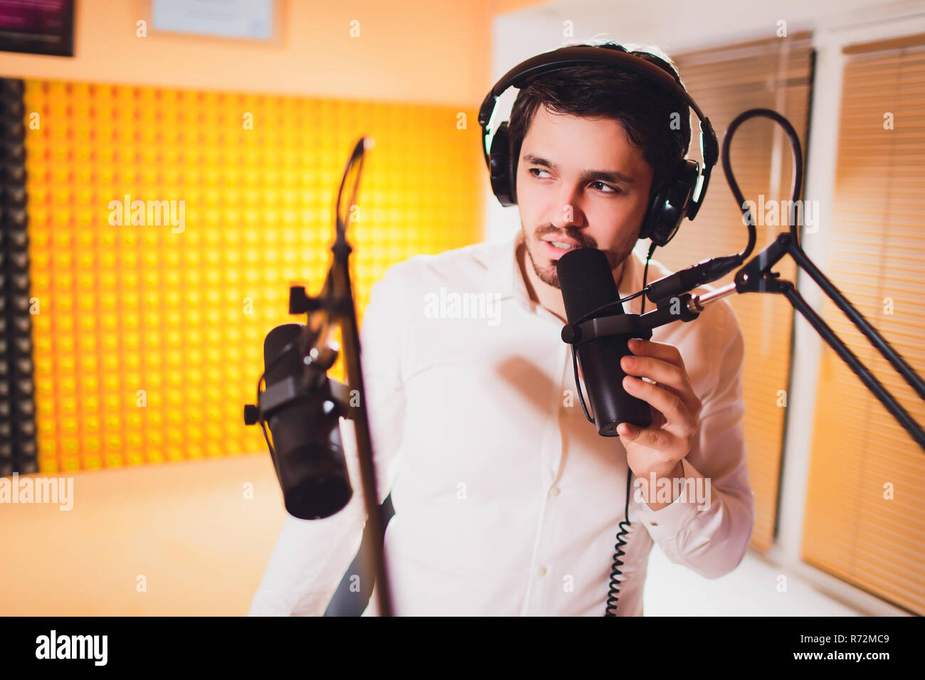 Radio host using sound mixer hi-res stock photography and images - Alamy