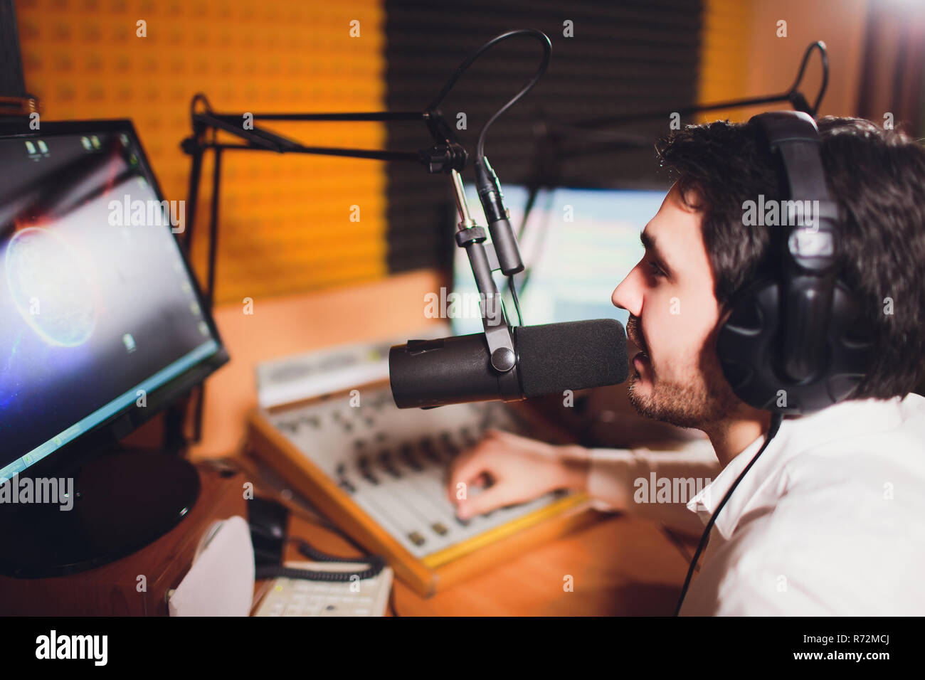 Radio host using sound mixer hi-res stock photography and images - Alamy