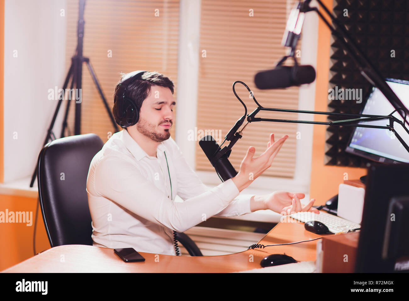 Radio host using sound mixer hi-res stock photography and images - Alamy