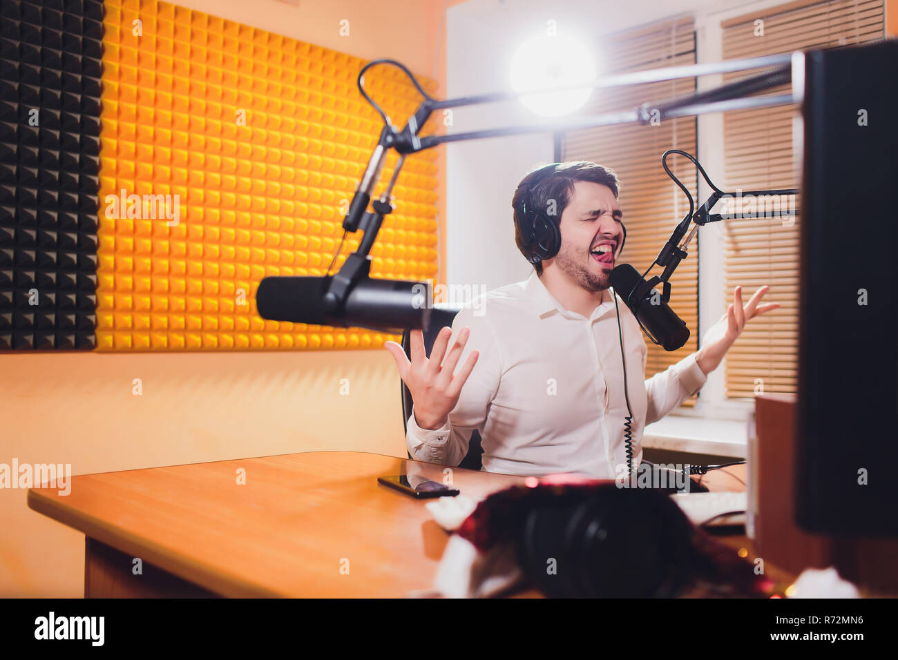 Radio host using sound mixer hi-res stock photography and images - Alamy