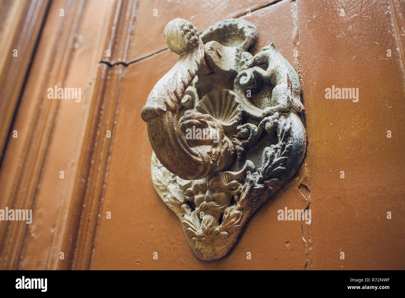 Door handles with an old double door. Golden Handle Door Entrance ...
