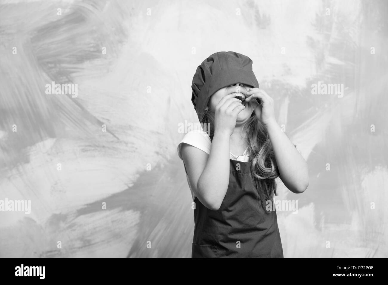 chef kid or happy little girl cook in red chef hat and apron on ...