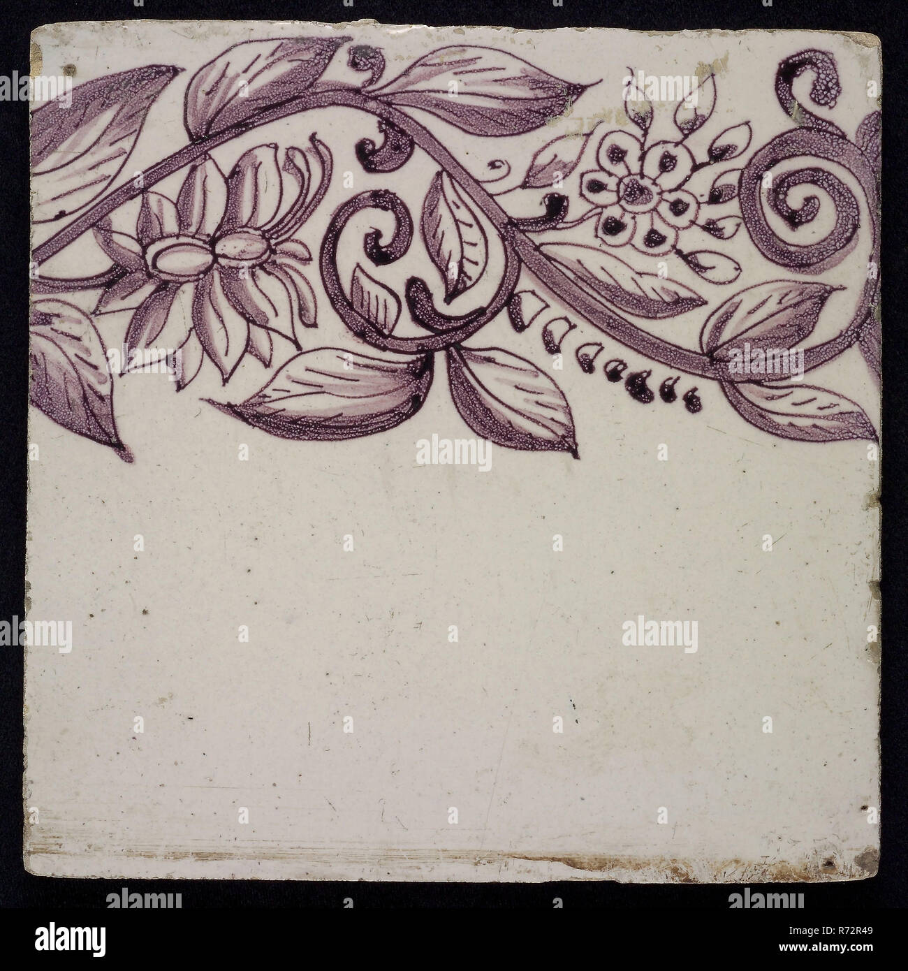 Border tile in purple with sling decoration of two flowers, leaves ...