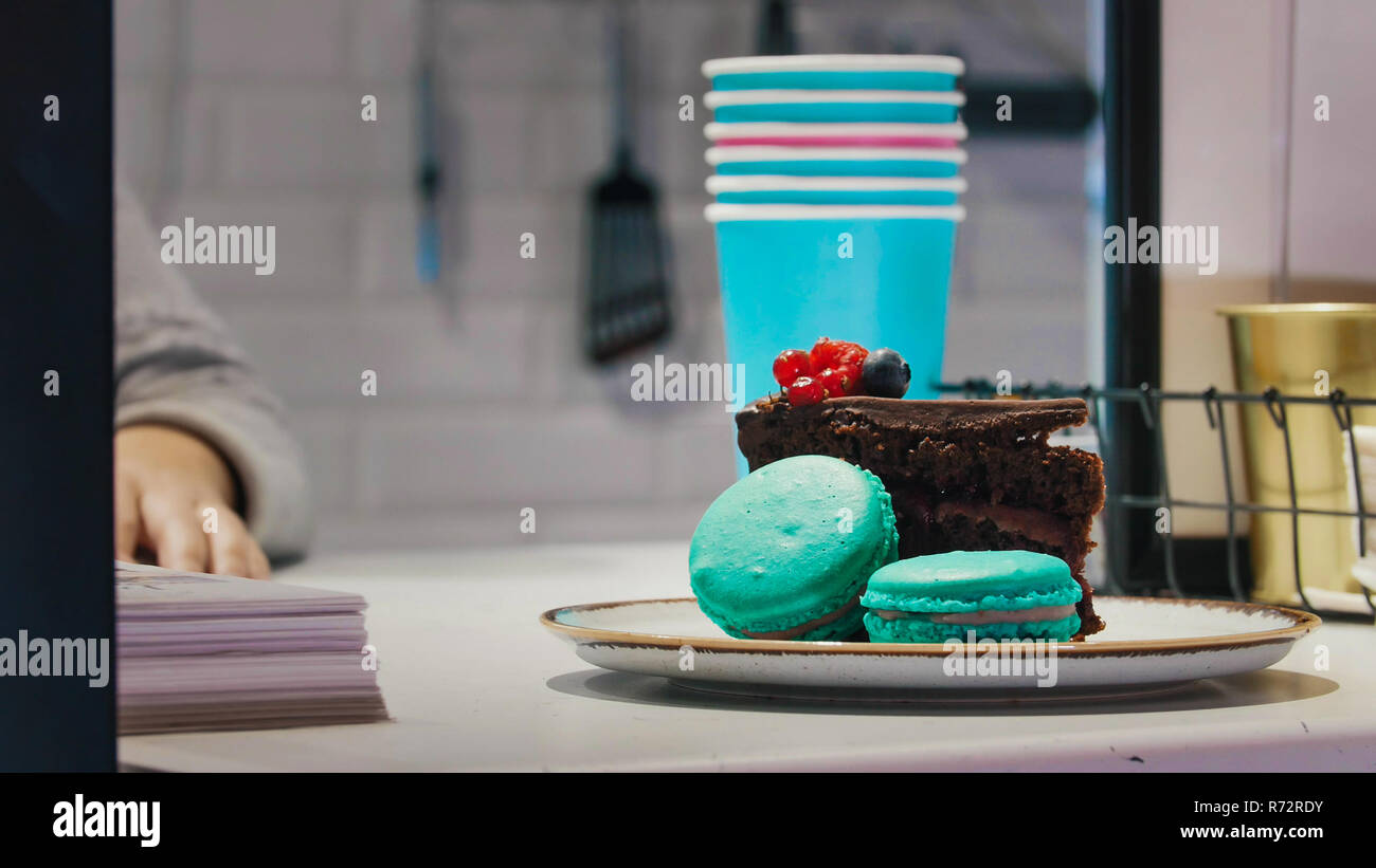 Blue macaroons on the check out waiting for the customer Stock Photo ...