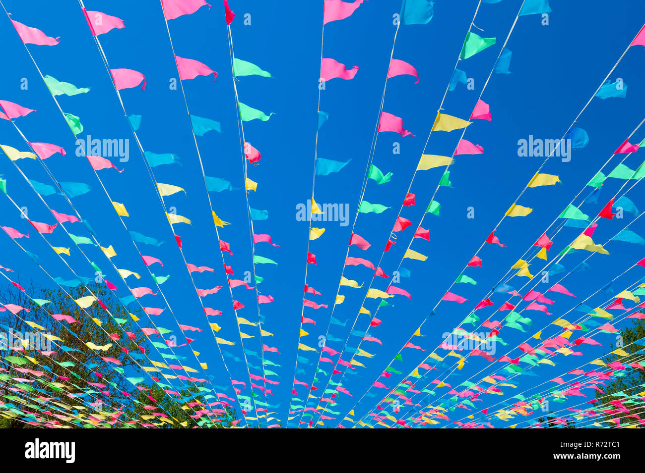 Colored flags against the sky, Ruh Ordo Cultural complex named after ...