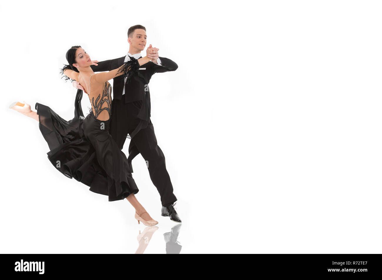 ballroom dance couple in a dance pose isolated on white background ...