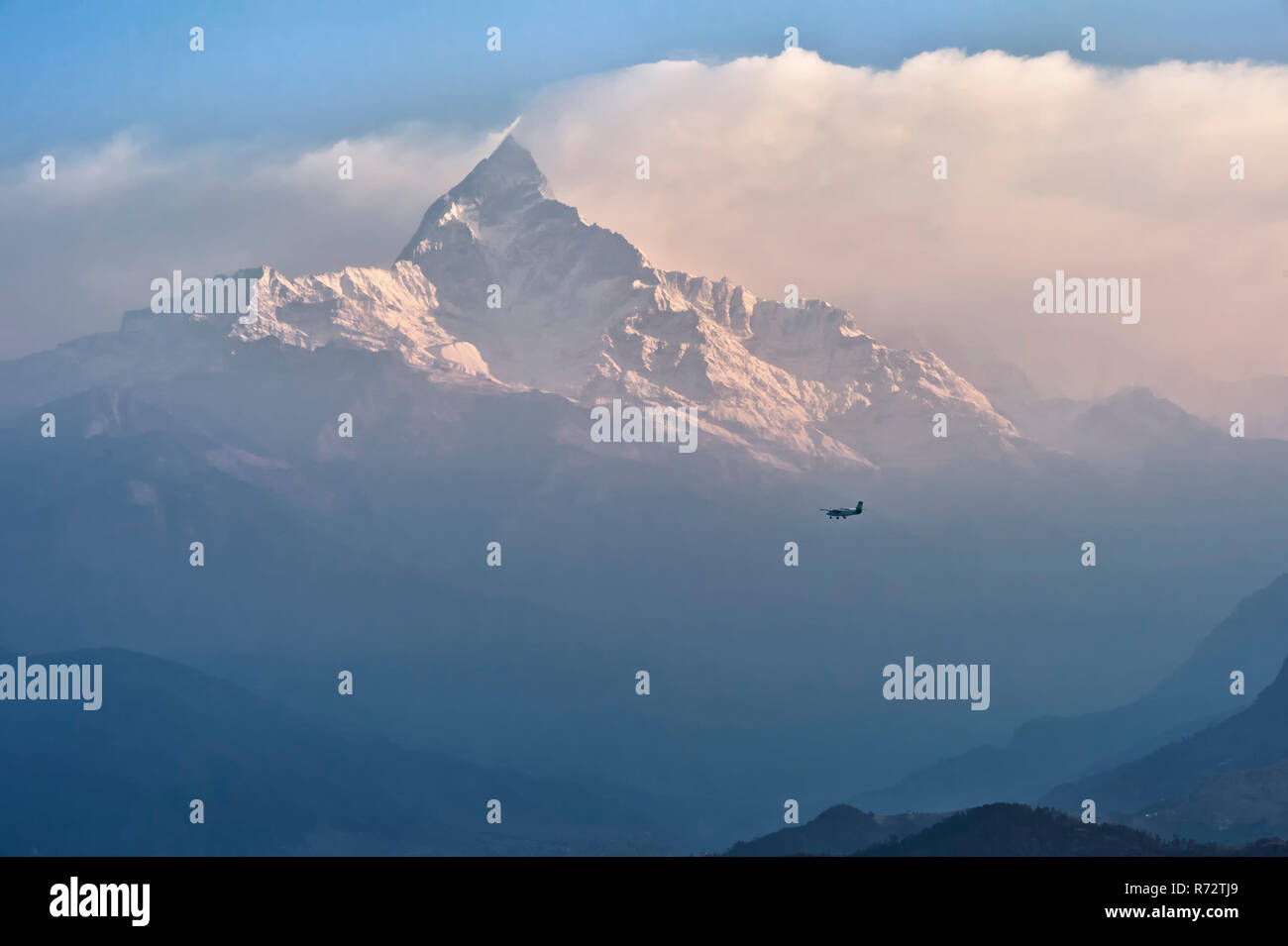 Small plane flying to the sacred peak Machhapuchhare fish tail mountain ...