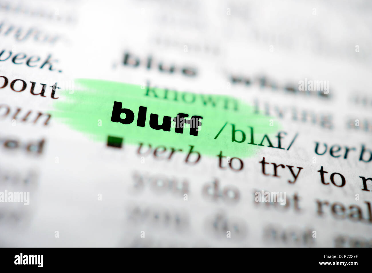 Closeup page with text BLUFF in colored highligh Stock Photo - Alamy