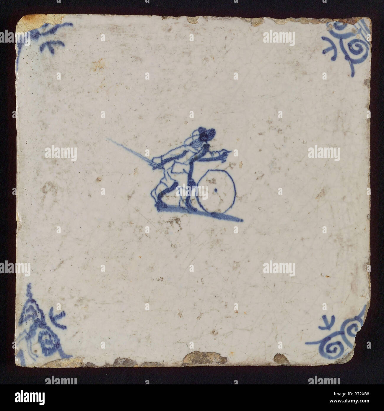 Scene tile, child's play, child with hoop, corner pattern ox's head ...