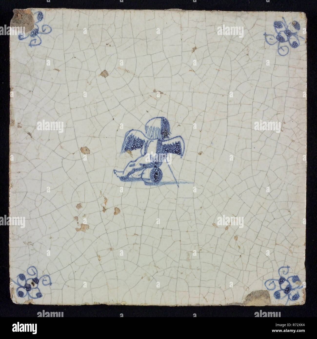 White tile with blue seated putto; corner motif spider, wall tile tile ...