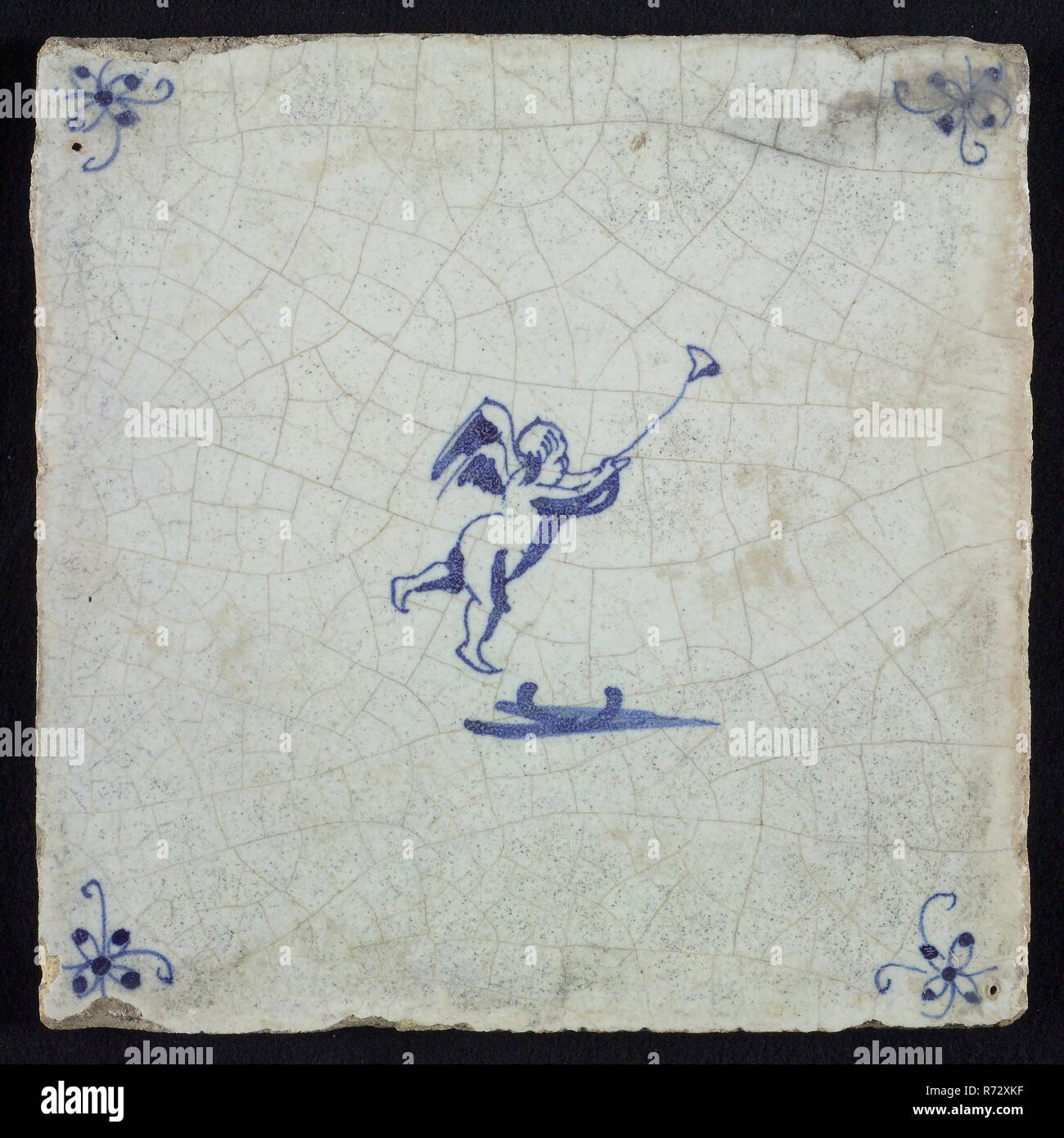 White tile with blue flying putto with wind instrument; corner motif ...