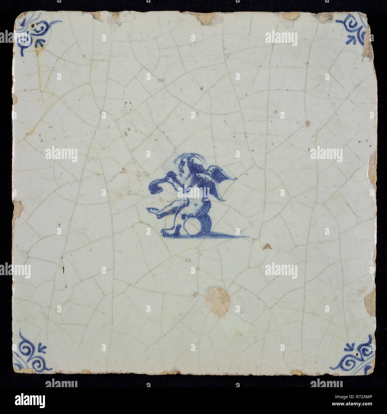 White tile with blue seated putto; corner pattern ox head, wall tile ...