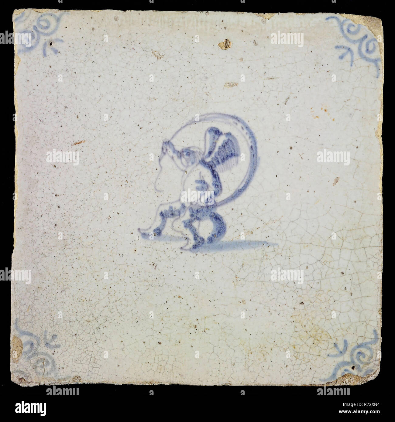 White tile with blue seated putto; corner pattern ox head, wall tile ...