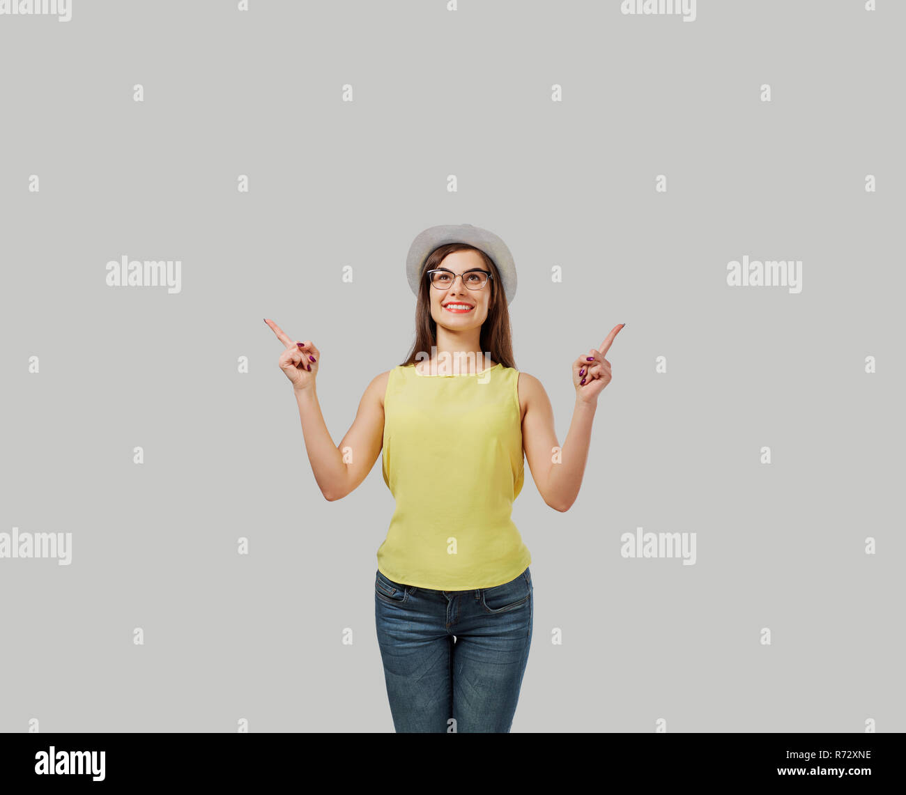 Woman looking up pointing copy hi-res stock photography and images - Alamy