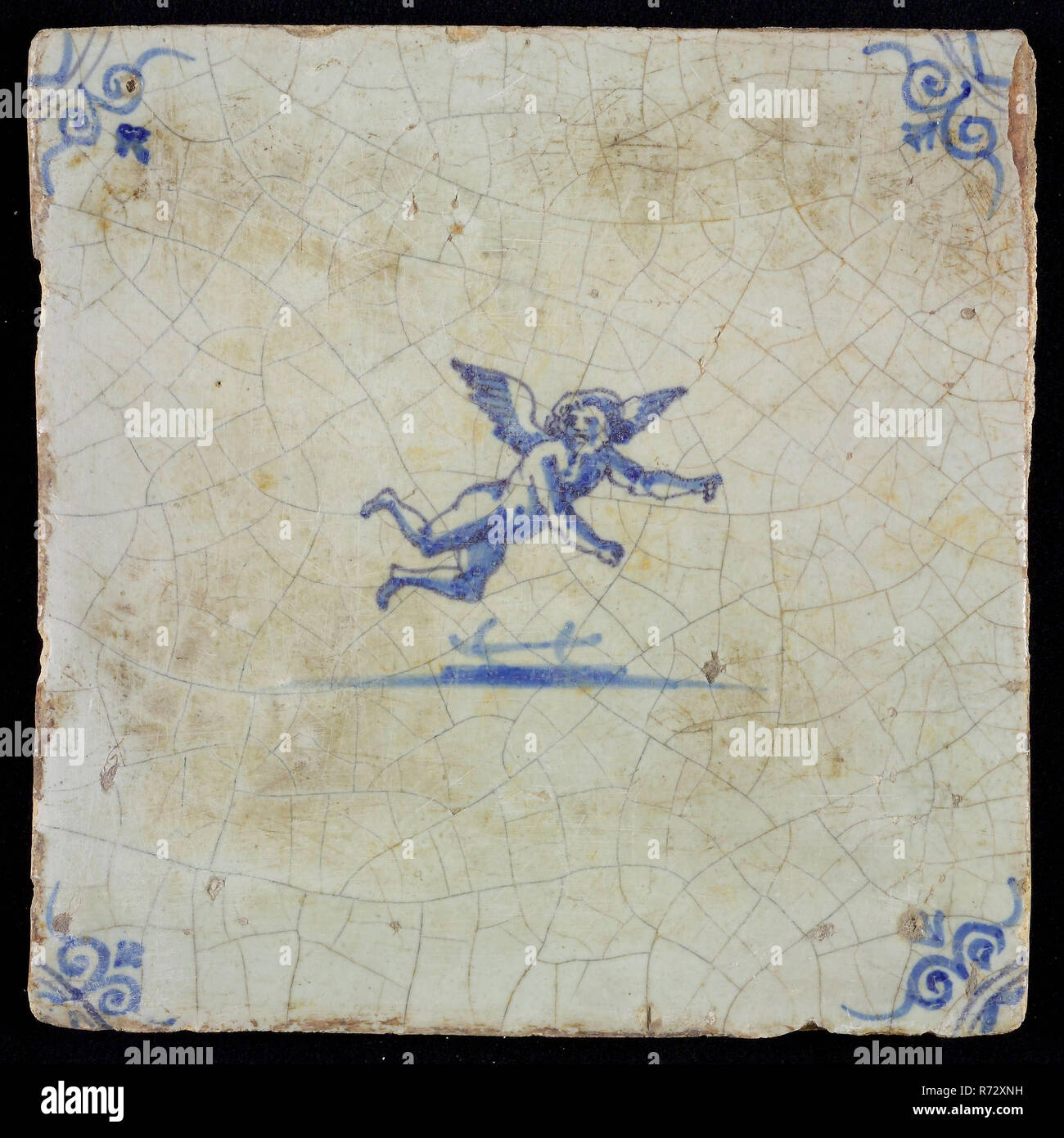 White tile with blue flying putto; corner pattern ox head, wall tile ...