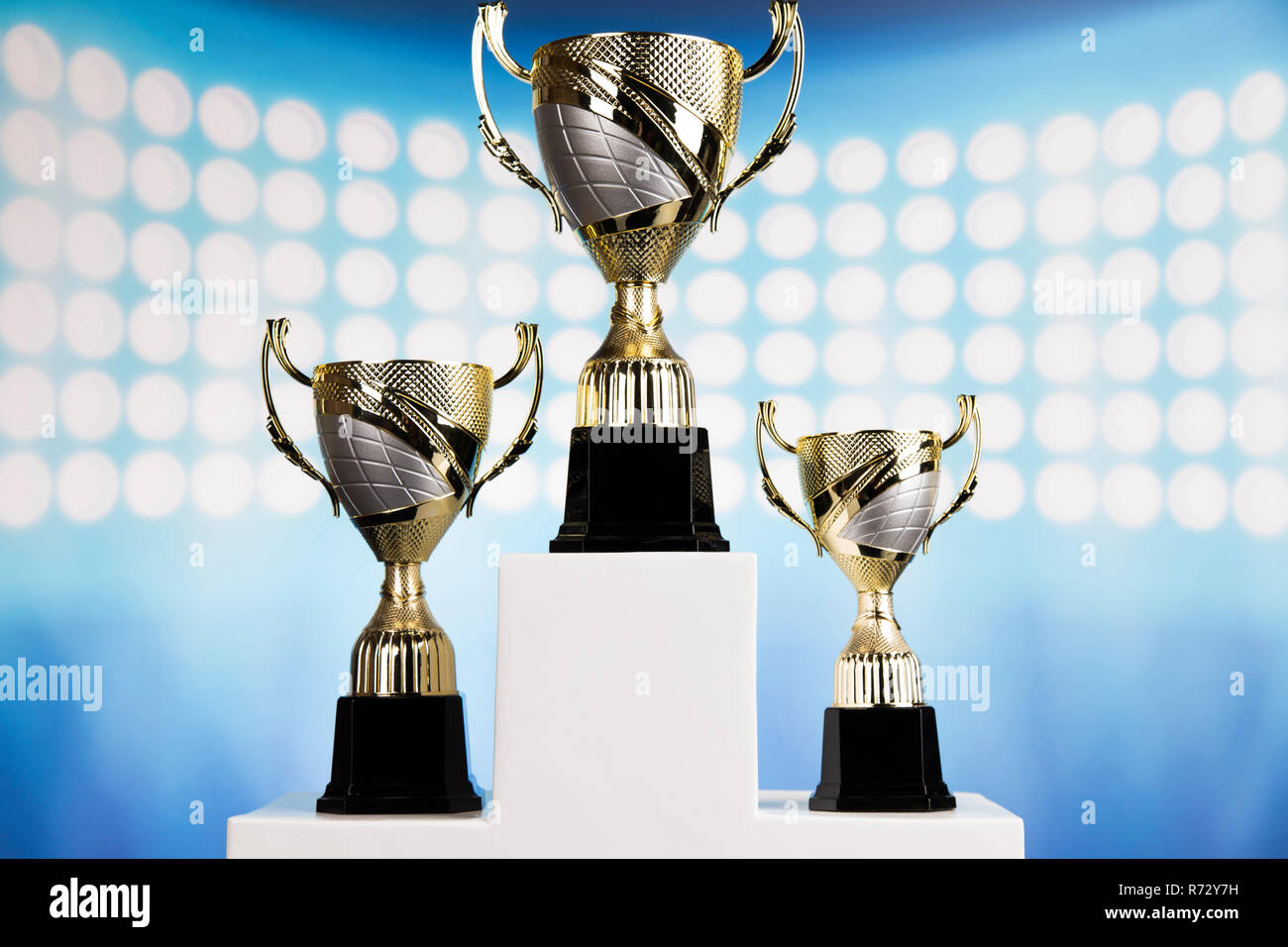 Sport podium, Cups of winners award Stock Photo - Alamy