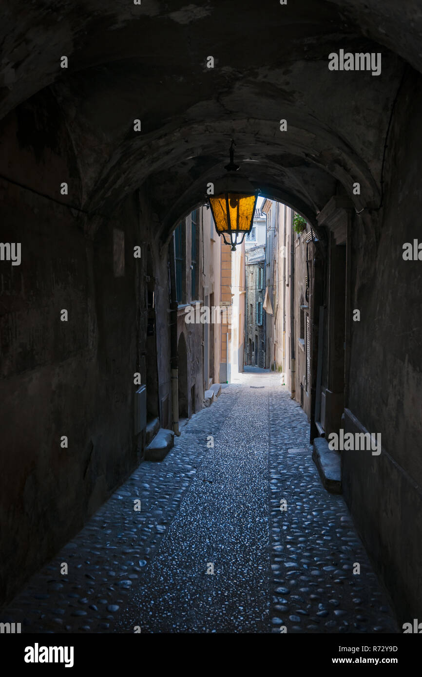 Covered arch passage in an old french medieval mountain village. An ...