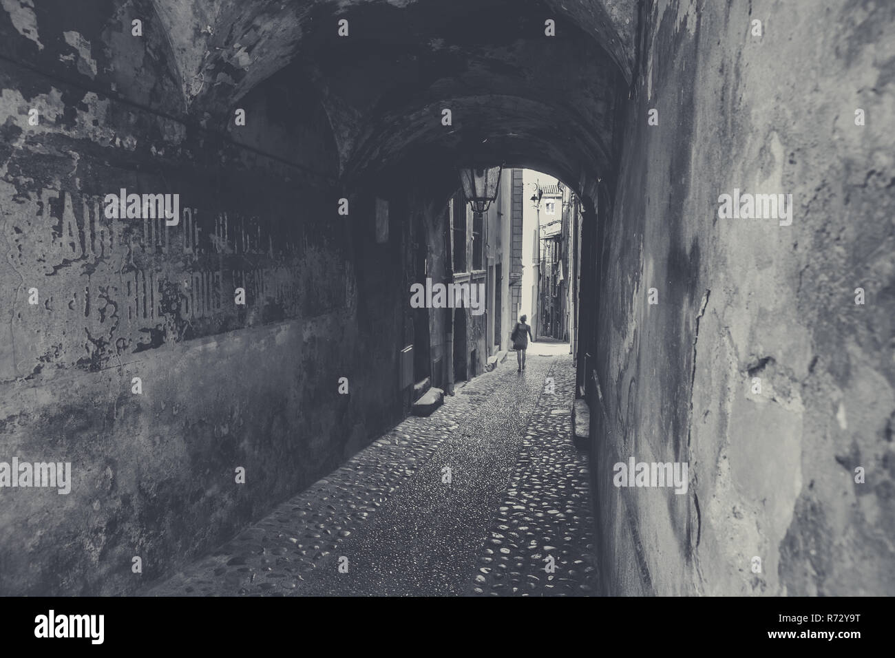 Covered arch passage in an old french medieval mountain village. An ...