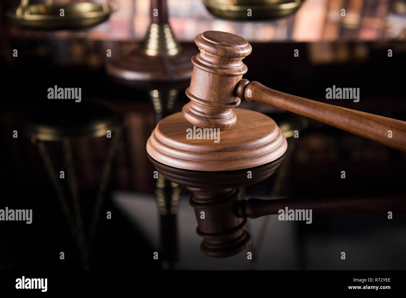 Law theme, mallet of judge, wooden gavel, mirror reflection background ...