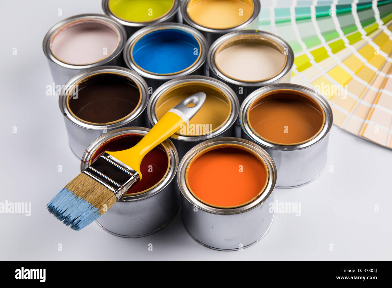 Tin cans with paint and brushes Stock Photo - Alamy
