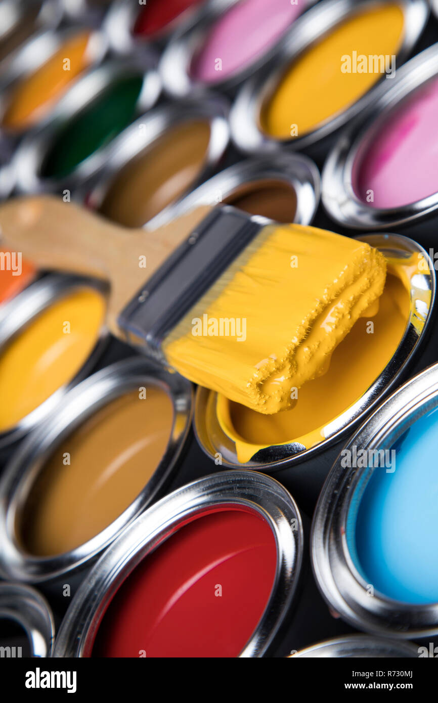 Open paint cans with a brush, Rainbow colors Stock Photo - Alamy