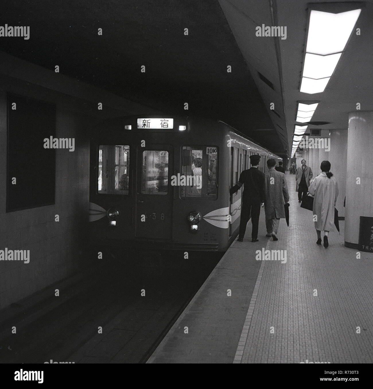 1960s, historical, a guard beside an underground train waiting at a ...