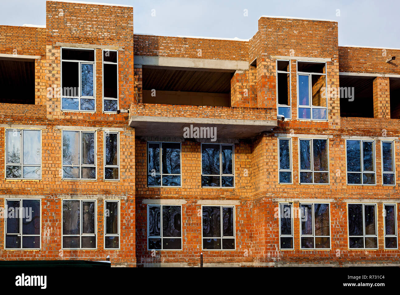 Brick house from a red brick, construction area construction of multi ...