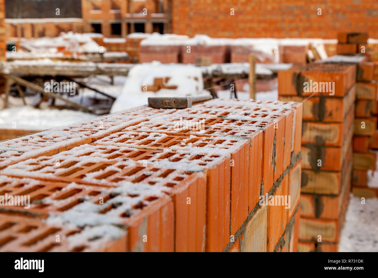 Bricklaying close-up. Brick house from a red brick, construction area ...