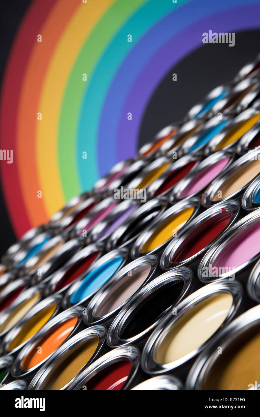 Rainbow, tin metal cans with color paint Stock Photo - Alamy