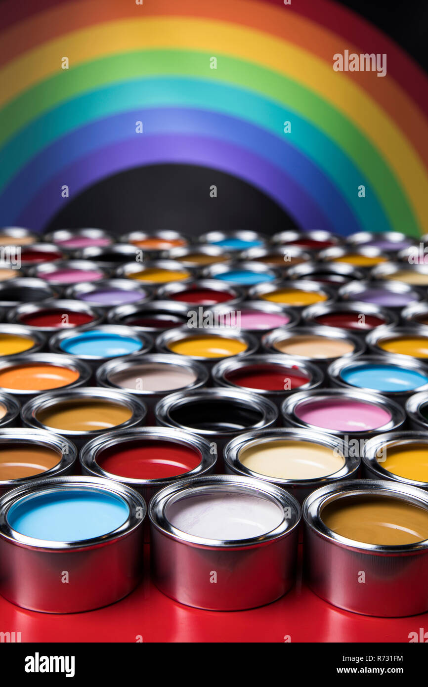 Rainbow colors, Group of tin metal cans Stock Photo - Alamy